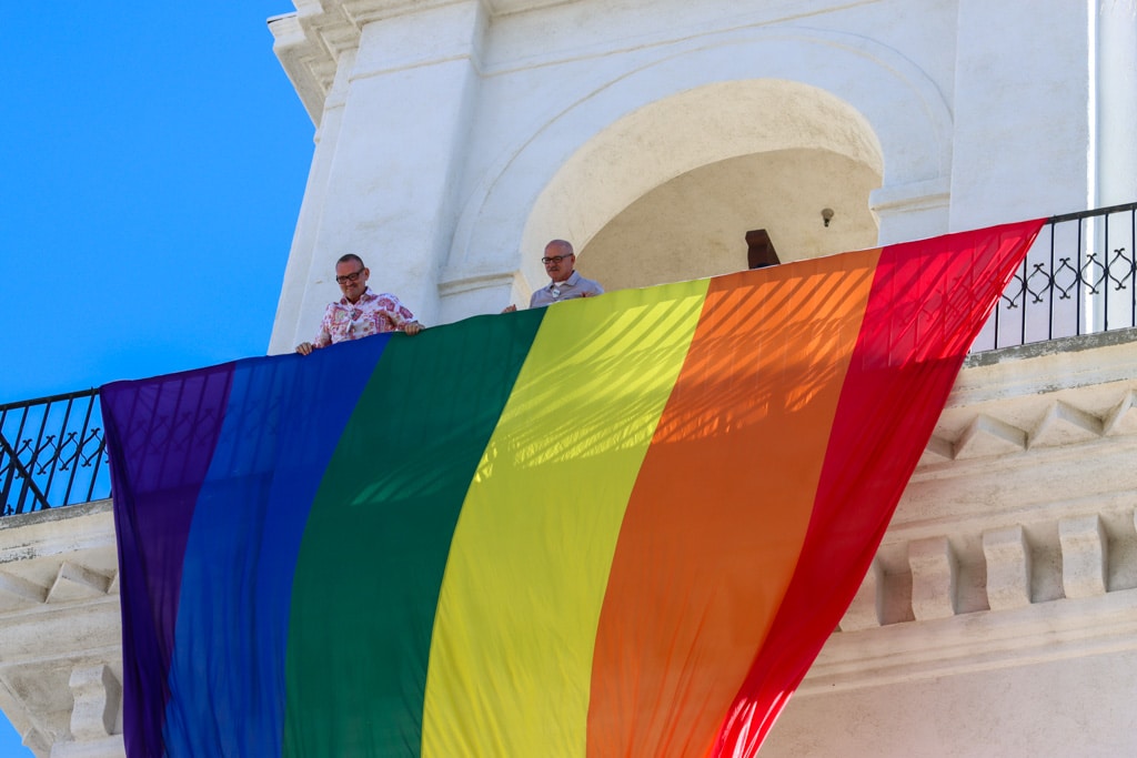Flag unfurled at historic bell tower as Palm Springs kicks off Pride ...